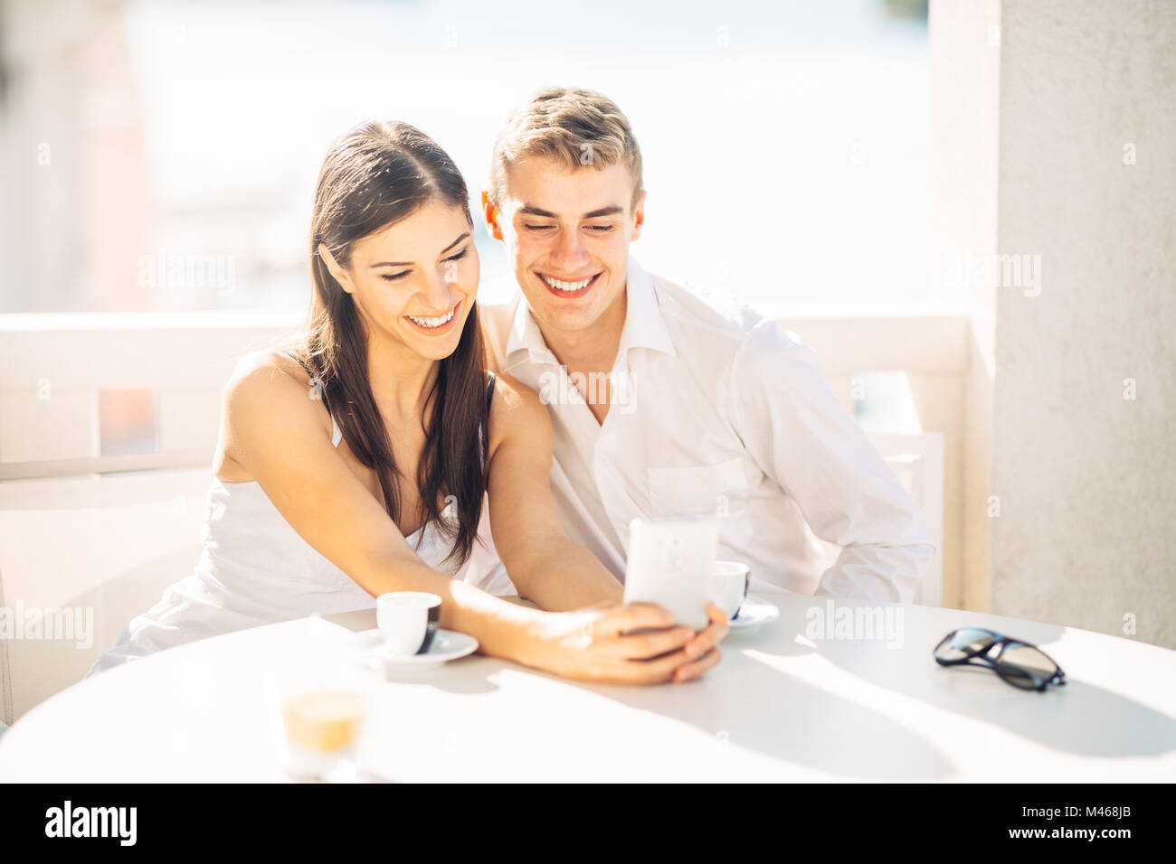 Attractive couple having first date.Coffee with a friend.Smiling happy ...