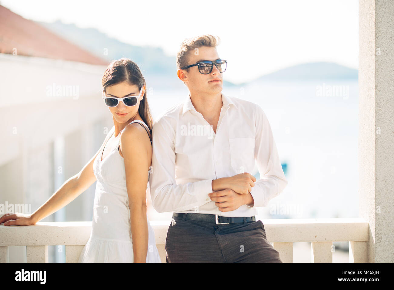 Attractive couple looking at amazing sea view.Enjoying sun and sunny ...