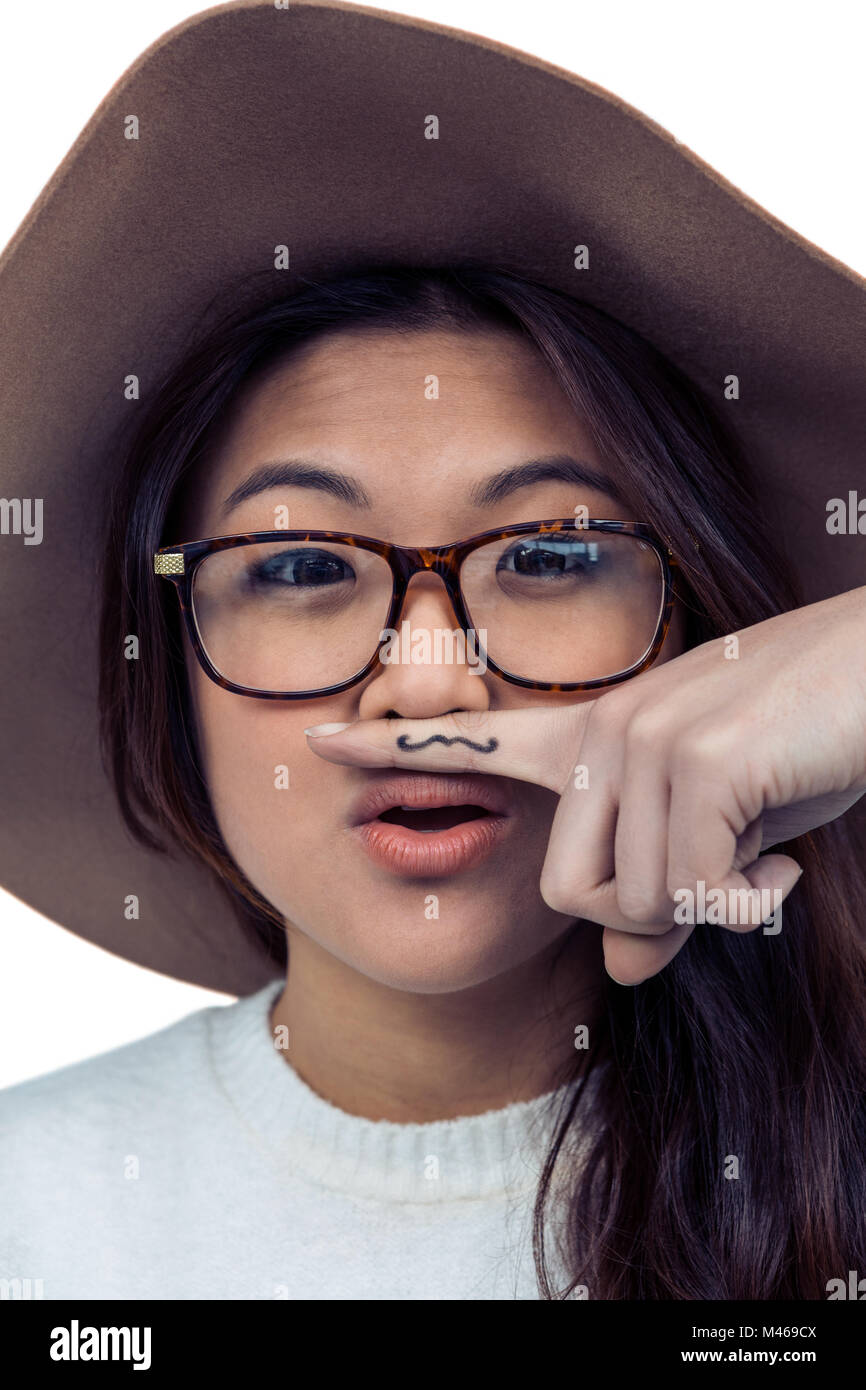 Asian woman with mustache on finger posing for the camera Stock Photo ...