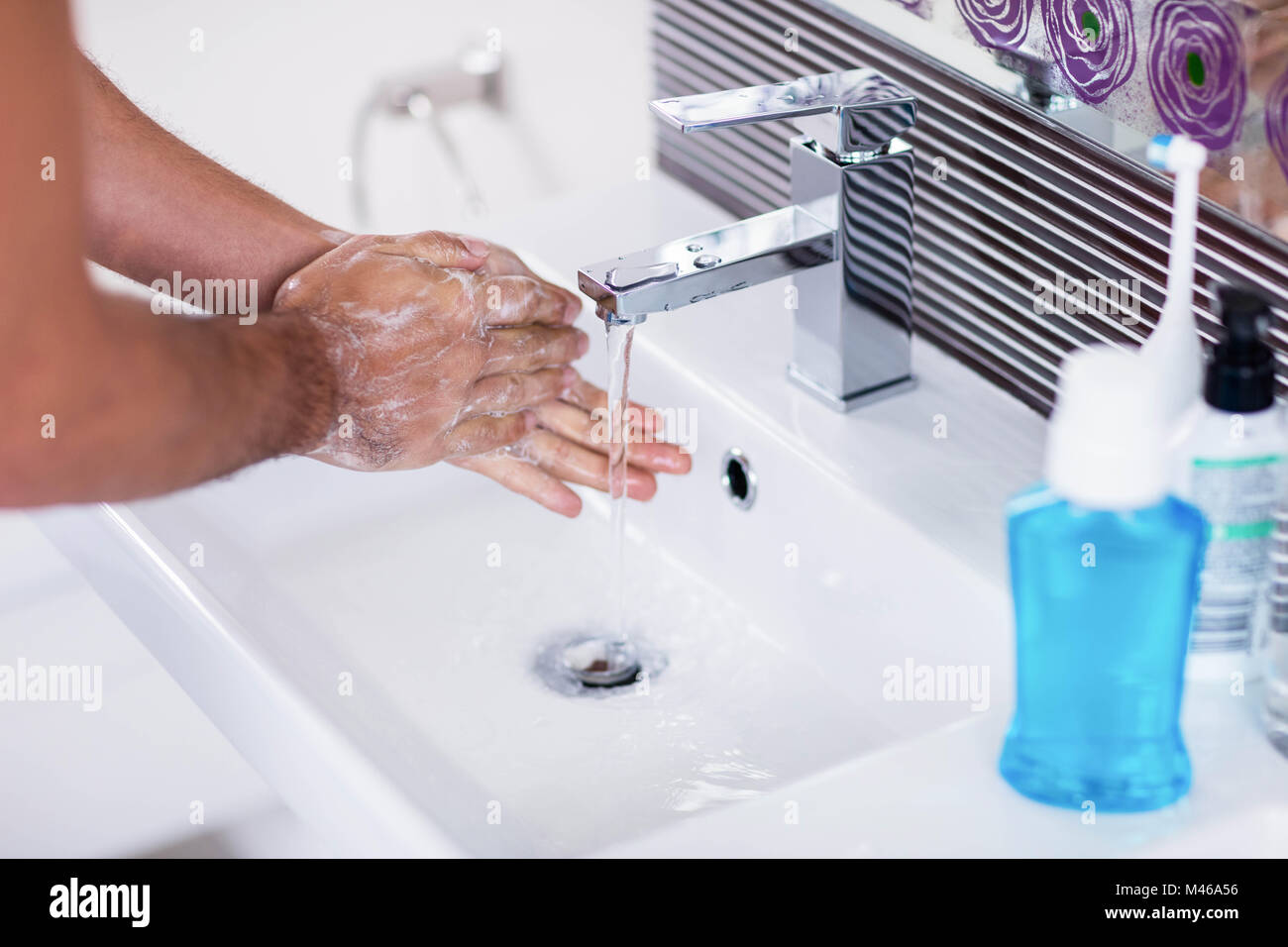 Close up of washing hands with soap under running water Stock Photo - Alamy
