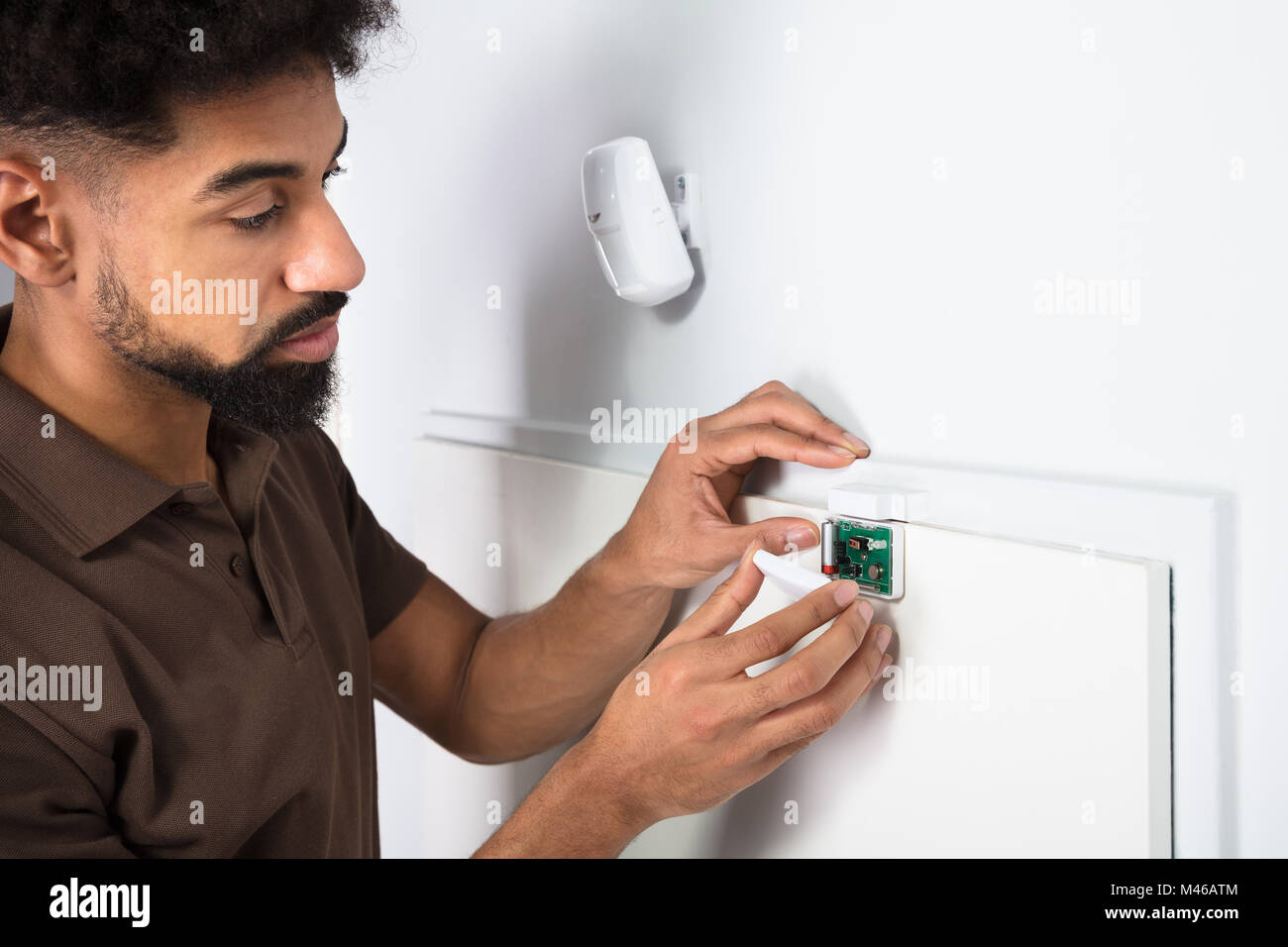 Close-up Of A Young Male Technician's Fixing Security System Door ...