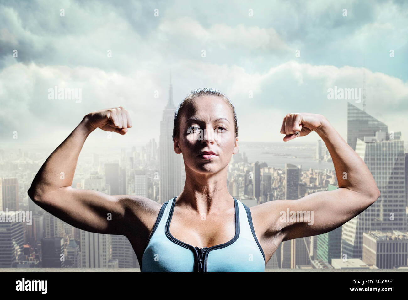 Composite image of thoughtful athlete flexing muscles Stock Photo - Alamy