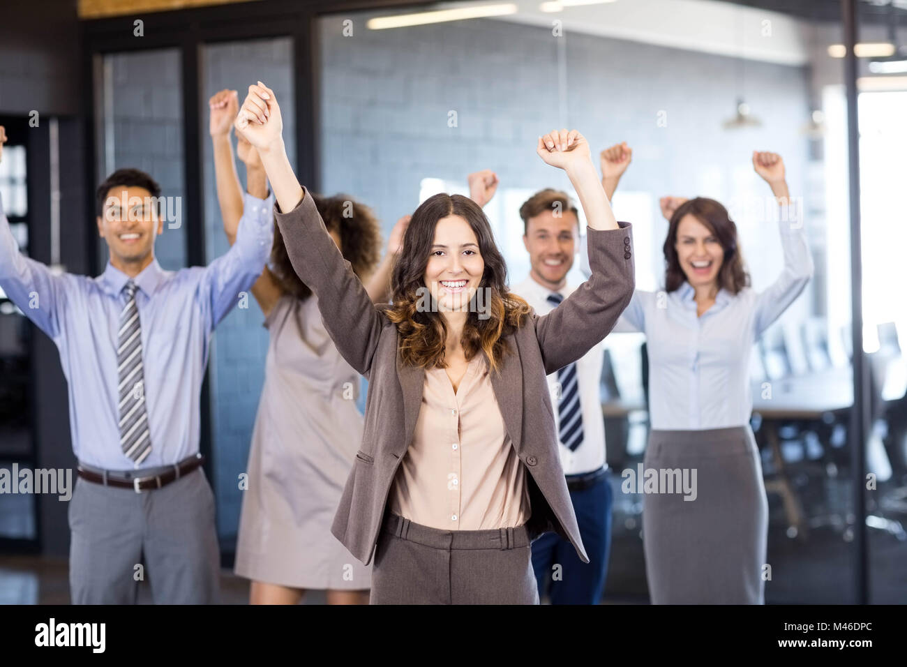 Successful business team celebrating their victory Stock Photo - Alamy