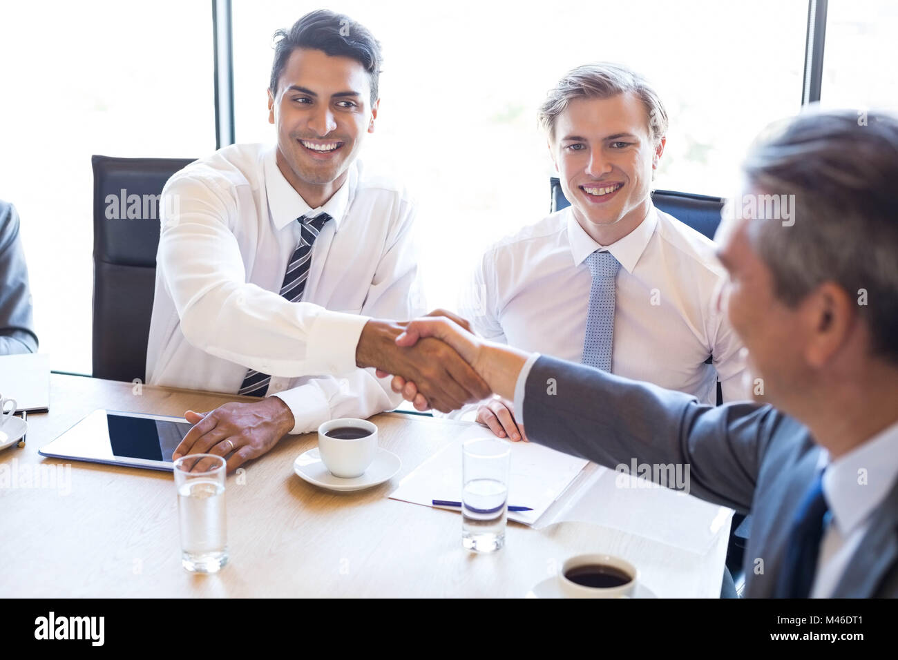 Businesspeople having a discussion in conference room Stock Photo - Alamy