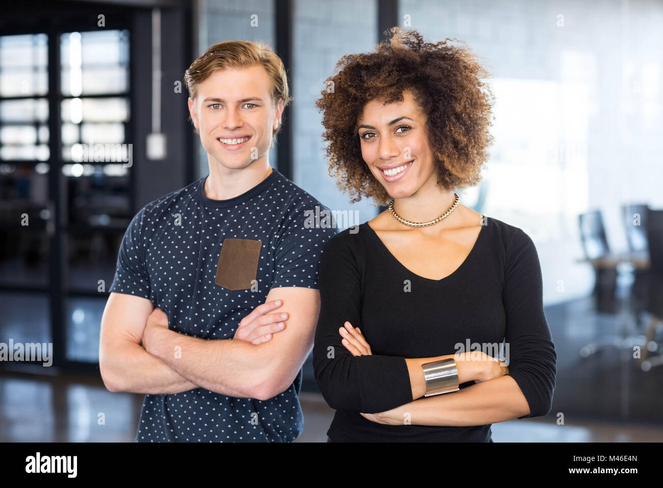 Portrait of business executives standing together in office Stock Photo ...