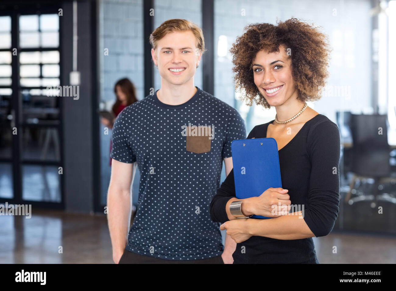 Portrait of business executives standing together in office Stock Photo ...