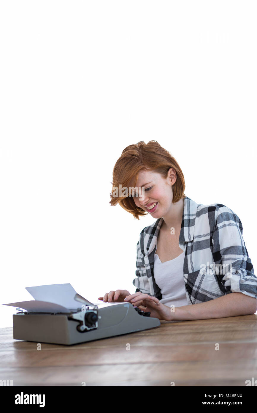 smiling hipster woman typing on her typewriter Stock Photo - Alamy