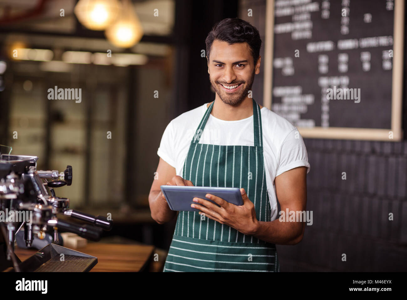 Smiling barista looking camera hi-res stock photography and images - Alamy