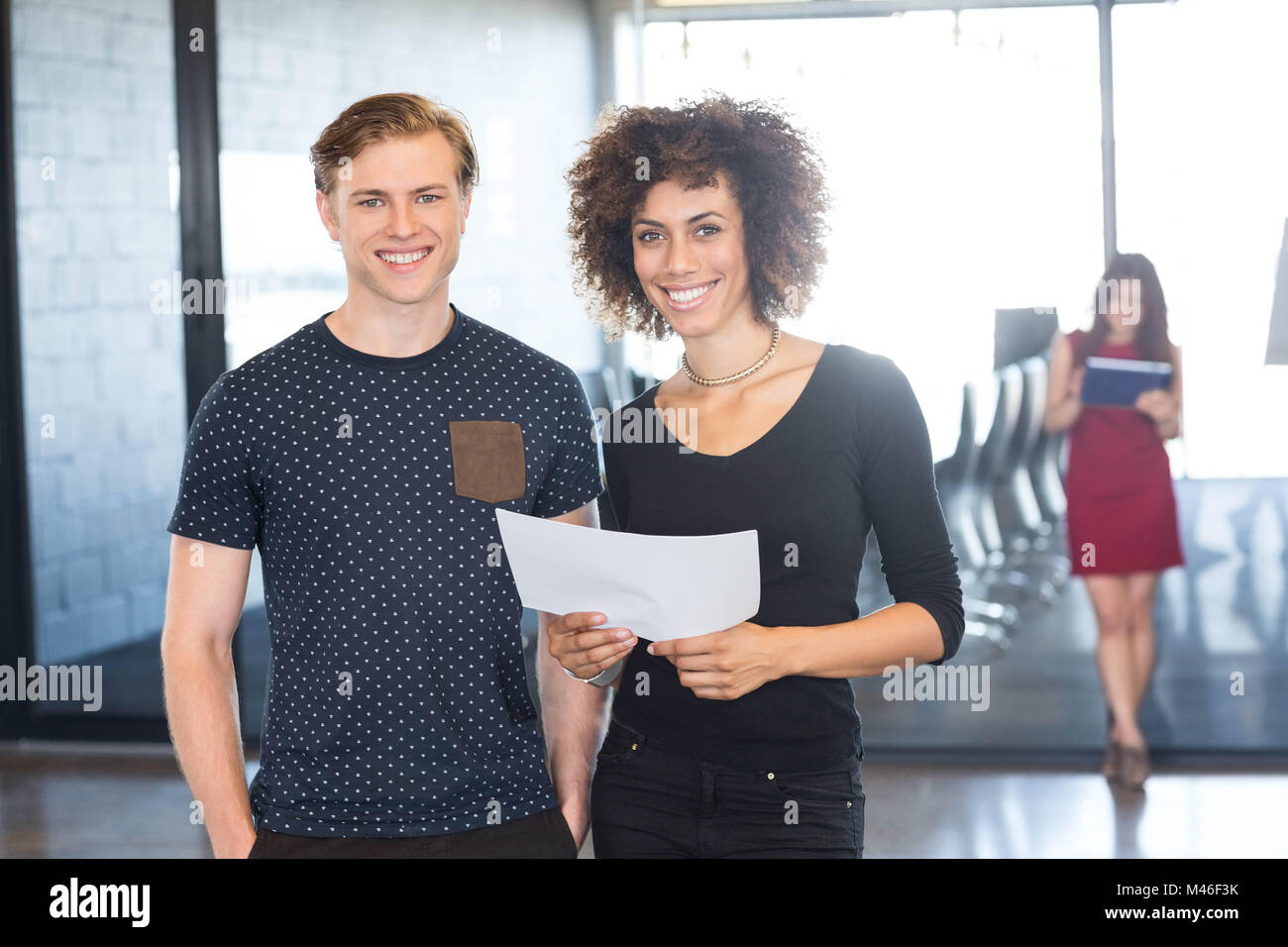 Portrait of business executives standing together in office Stock Photo ...