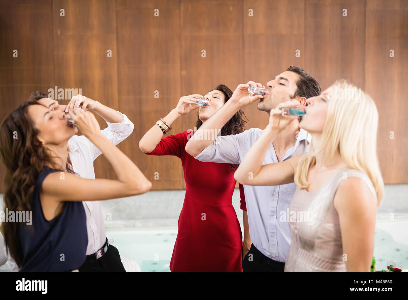 Young and handsome group of friends drinking shots Stock Photo - Alamy