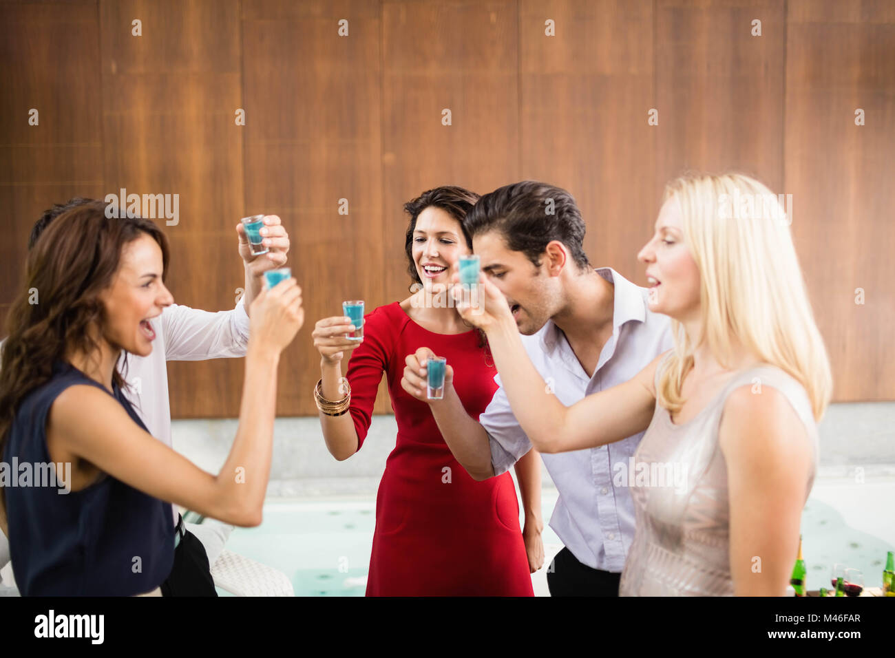 Young and handsome group of friends drinking shots Stock Photo - Alamy