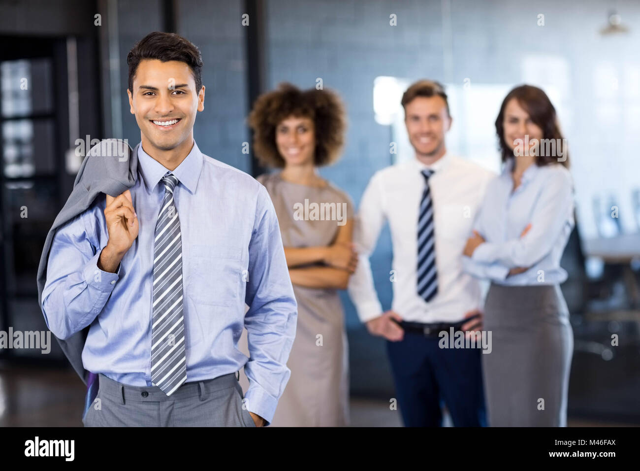 Portrait of confident business team in office Stock Photo - Alamy