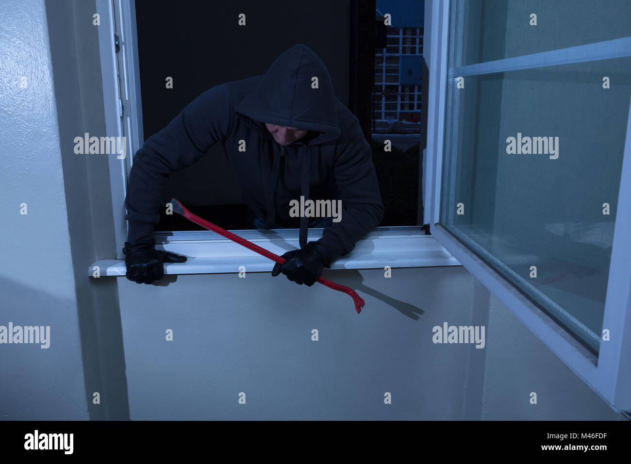 Man criminal crowbar house hi-res stock photography and images - Alamy