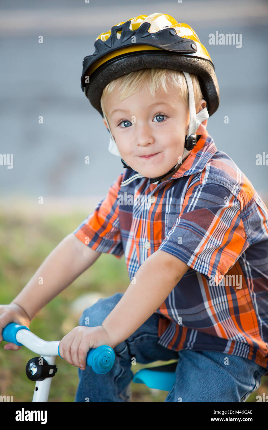 Young boy learning to ride bike Stock Photo - Alamy