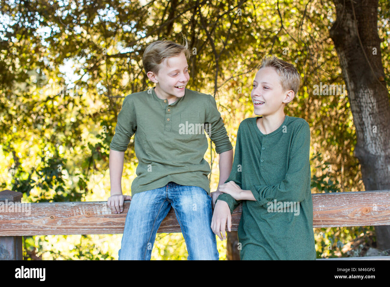 Young brothers playing together outside Stock Photo - Alamy