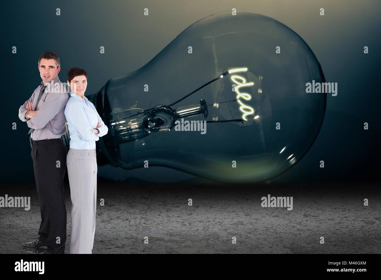 Business people standing in front of light bulb Stock Photo - Alamy