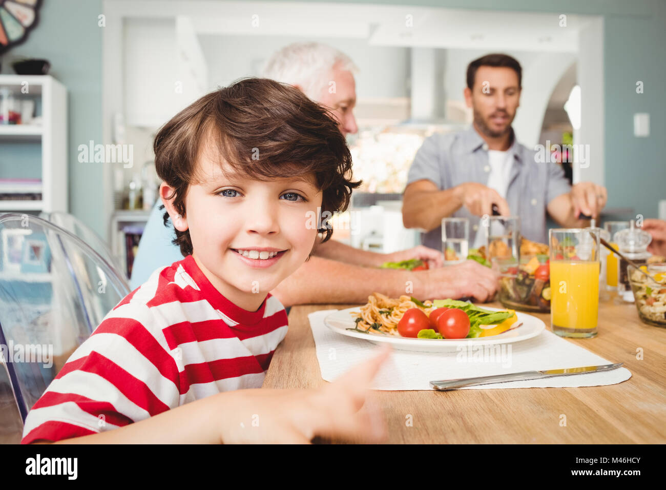Boy at dining table hi-res stock photography and images - Alamy