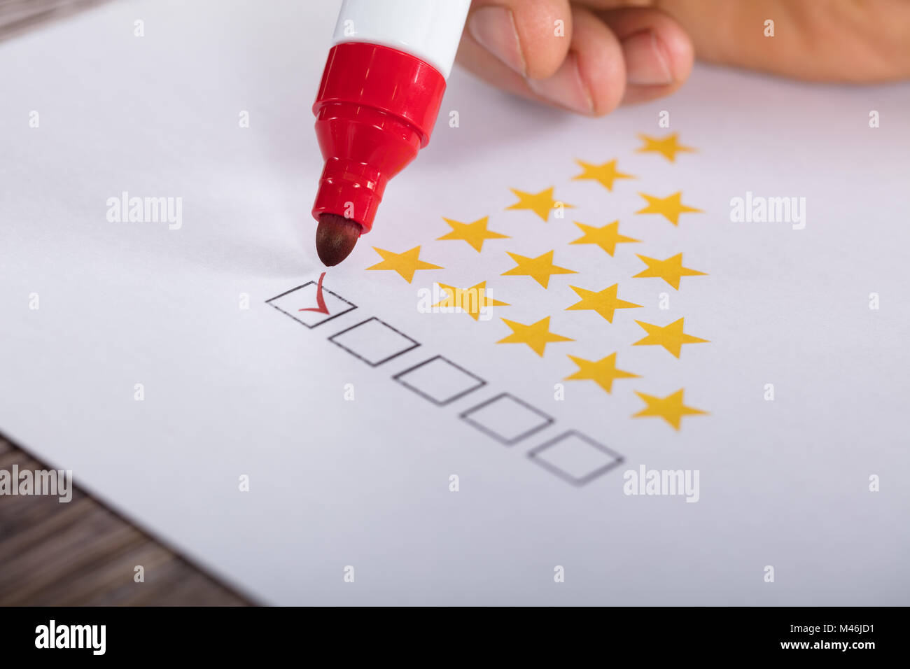 Person Giving Best Rating On Paper Using Red Marker Stock Photo - Alamy