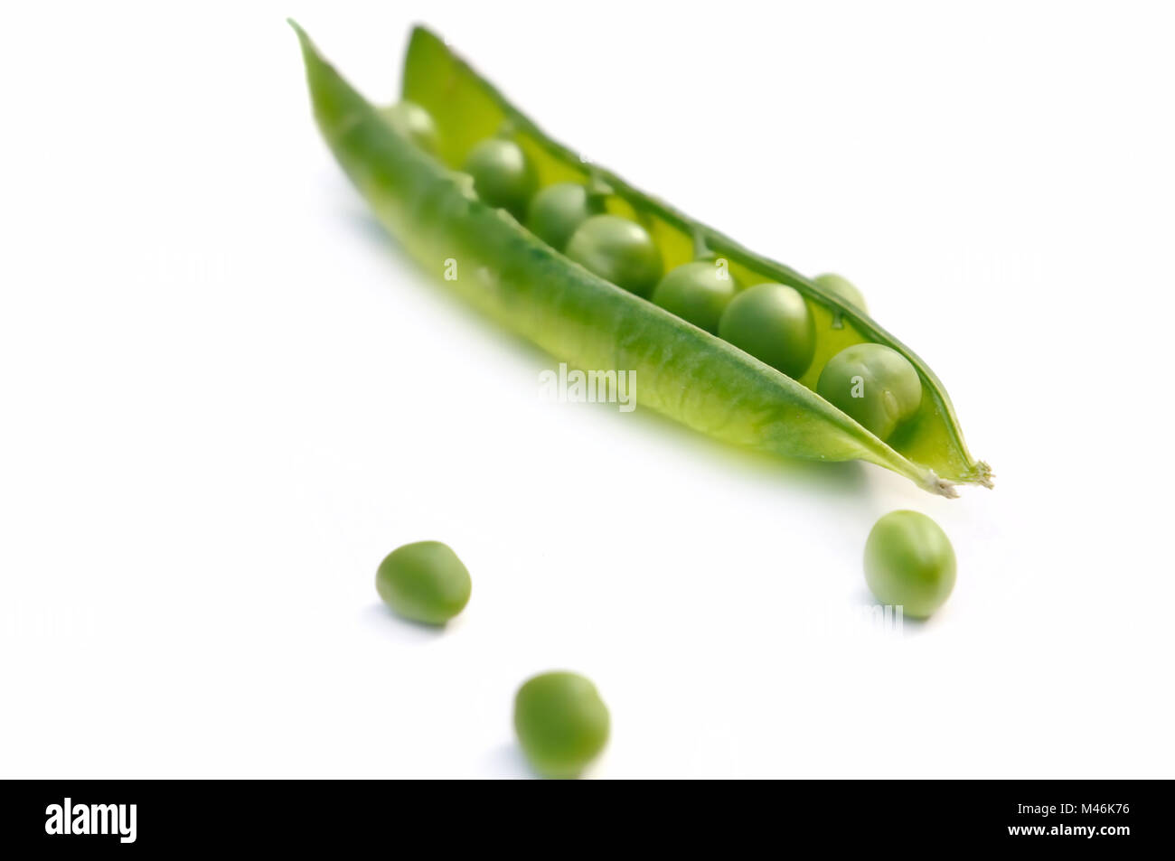 fresh pea in pod isolated on white background Stock Photo - Alamy