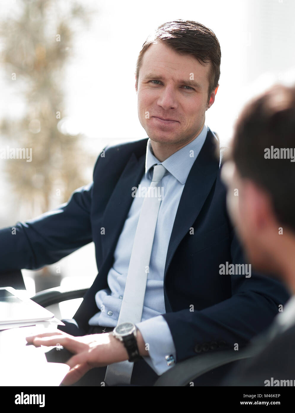 Boss sitting behind desk hi-res stock photography and images - Alamy