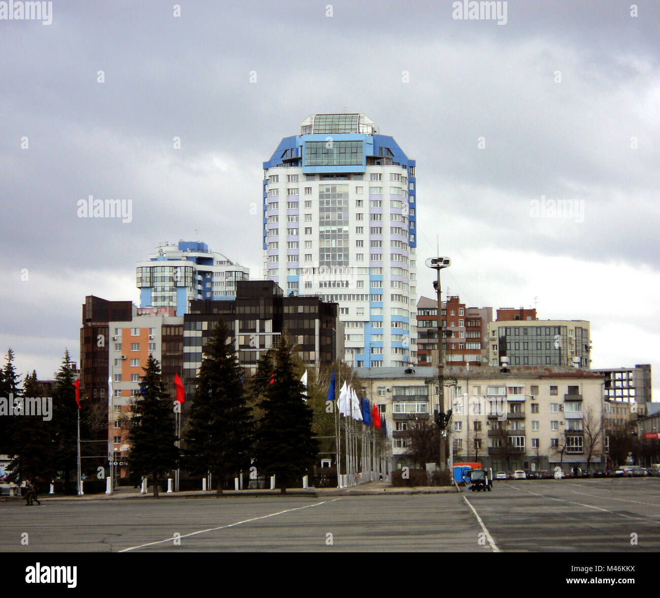 Landscape with white modern building with blue roof Stock Photo - Alamy