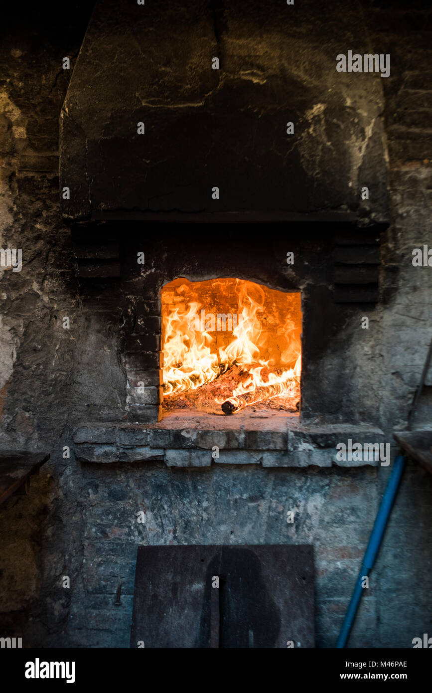 Fire in outdoor brick oven Stock Photo - Alamy
