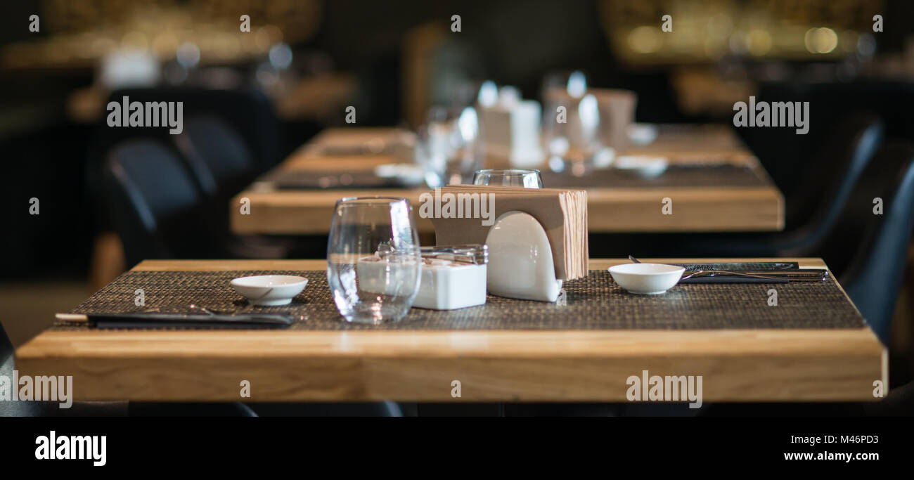 Table setting, interior elements and silverware in japaneese restaurant ...
