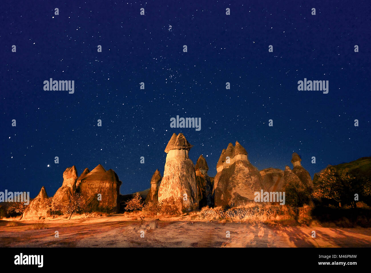 Fairy chimneys at night with stars in the sky, Cappadocia, Turkey Stock ...