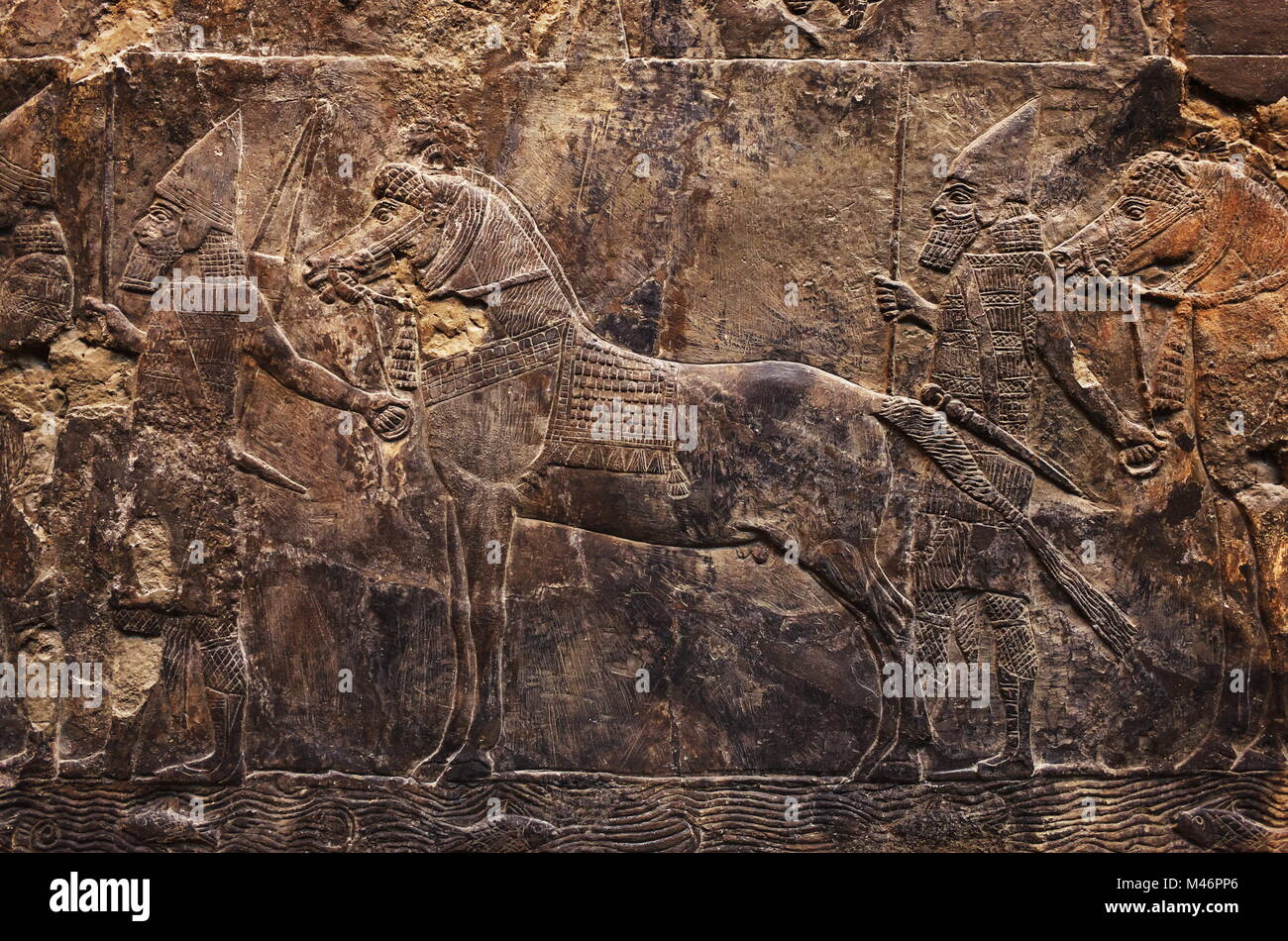 Assyrian wall art relief at the British Museum, London, England, UK ...