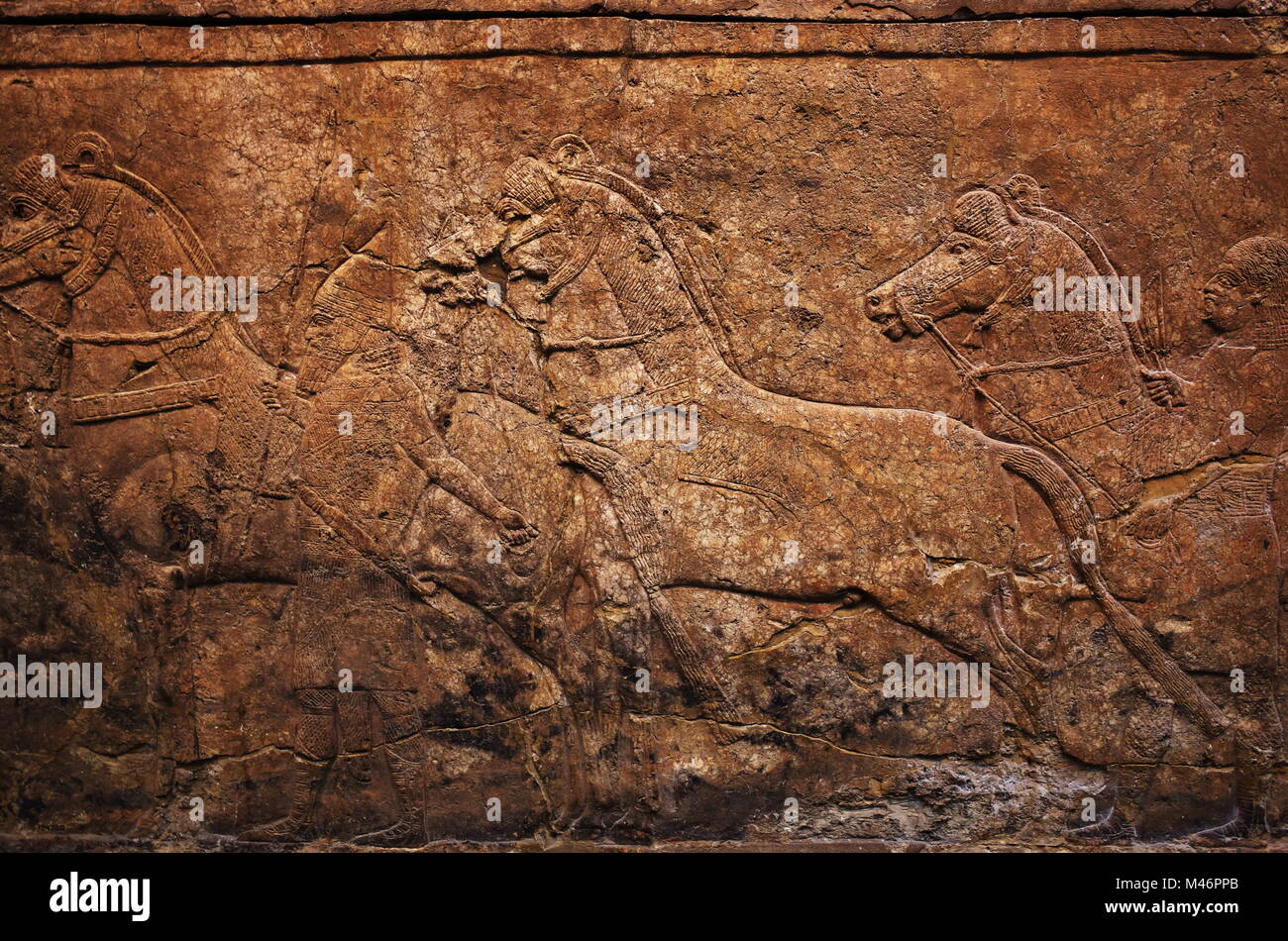 Assyrian wall art relief at the British Museum, London, England, UK ...