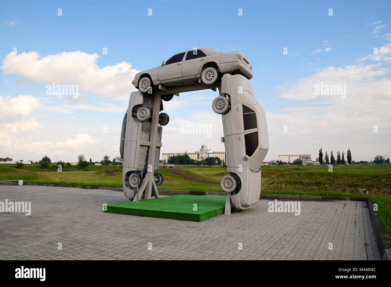 Homemade sculpture of three cars. Monument to the cyrillic letter P ...