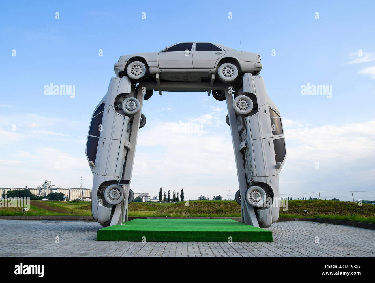 Homemade sculpture of three cars. Monument to the cyrillic letter P ...