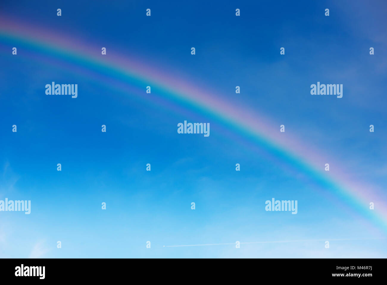 rainbow and trail plane Stock Photo - Alamy