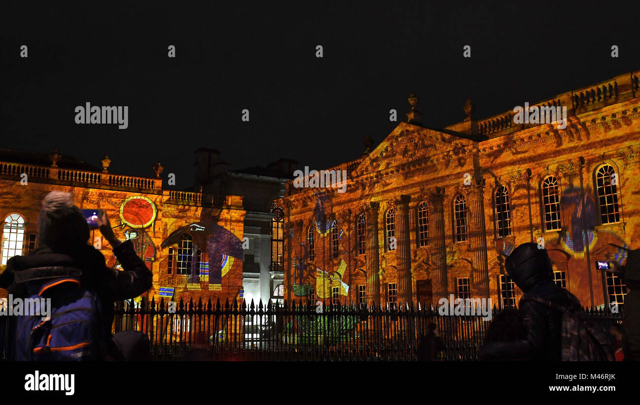 People take photos of Senate House lit up with projections during the e ...