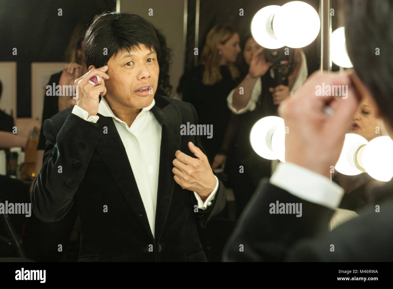 New York, NY - February 13, 2018: Designer Zang Toi prepares backstage ...