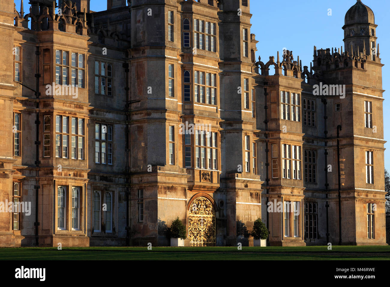 Sunset over the West elevation and the Golden gate, Burghley House ...