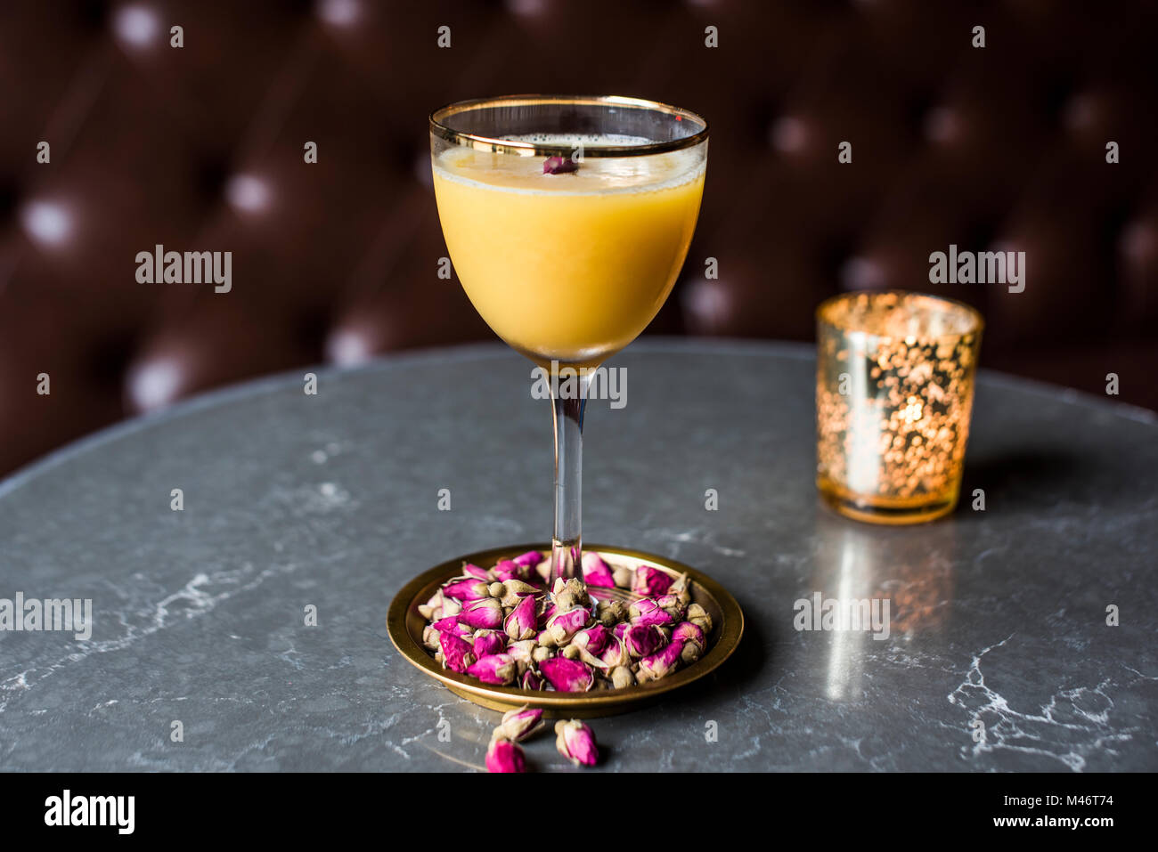 Cocktail with rose buds Stock Photo - Alamy