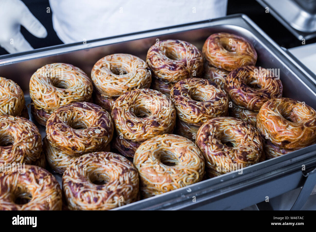 Spaghetti donuts being served at a food event Stock Photo - Alamy