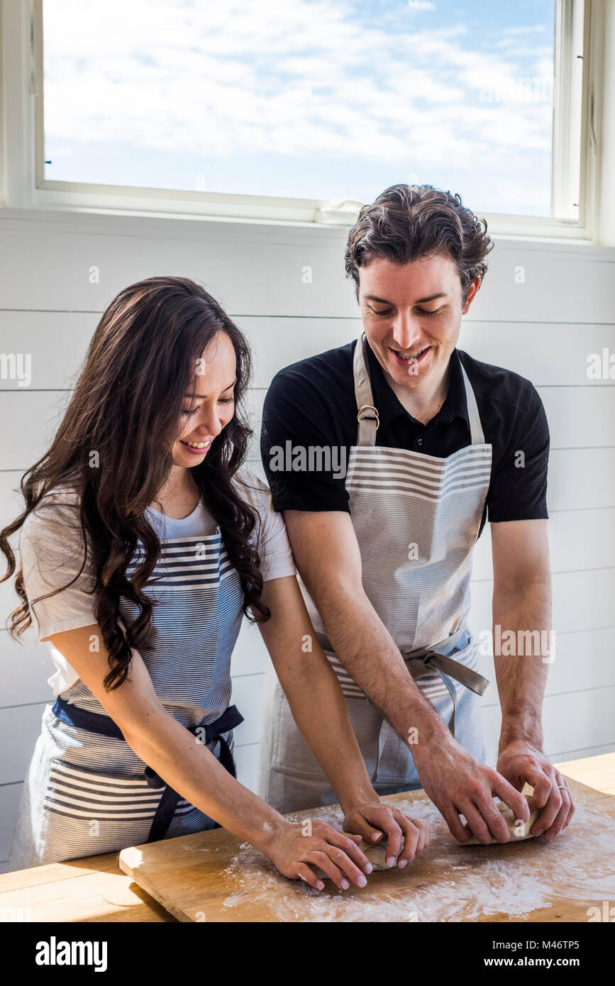 Couple baking together Stock Photo - Alamy