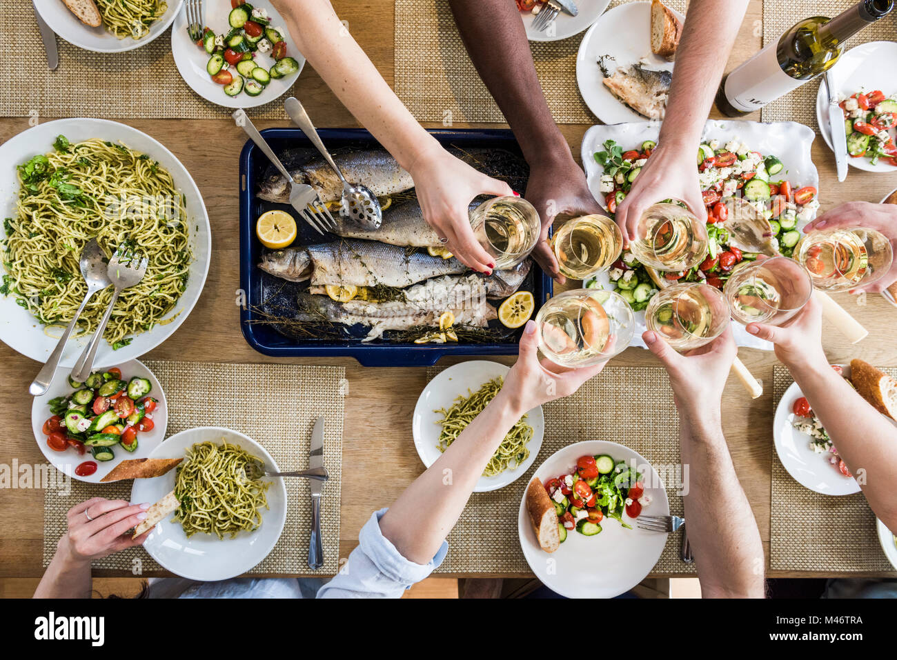 Friends enjoying a meal together Stock Photo - Alamy