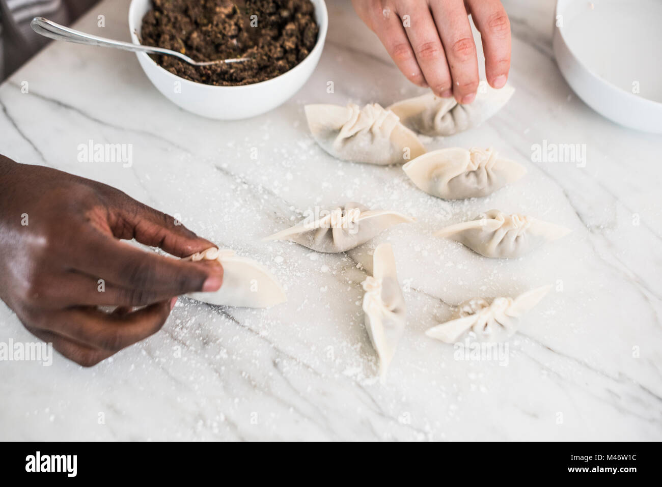 Making dumplings together Stock Photo - Alamy