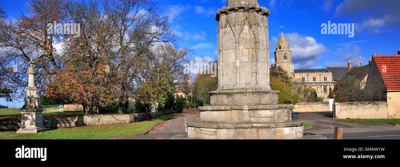The Market Cross with St Botolphs Church, Helpston village ...