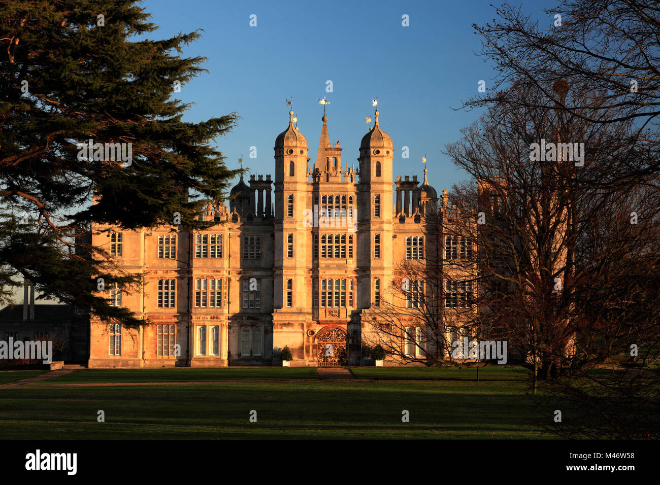 Sunset over the West elevation and the Golden gate, Burghley House ...