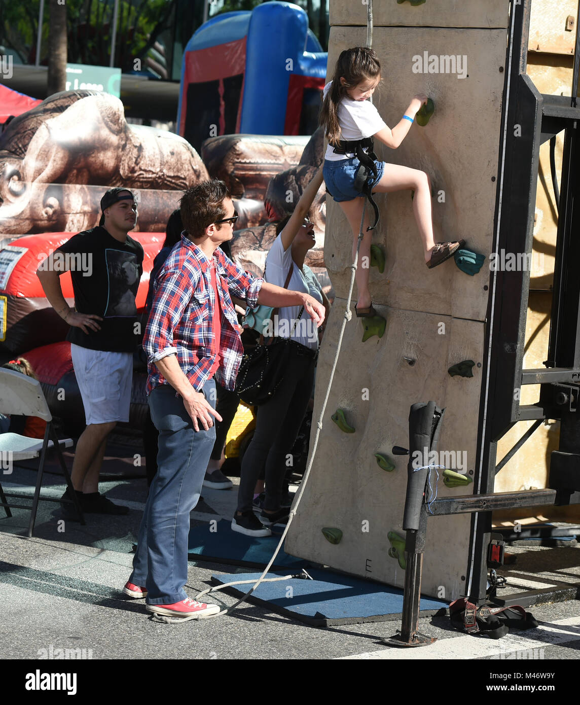 Johnny Knoxville watches as daughter Arlo Clapp takes on the climbing ...