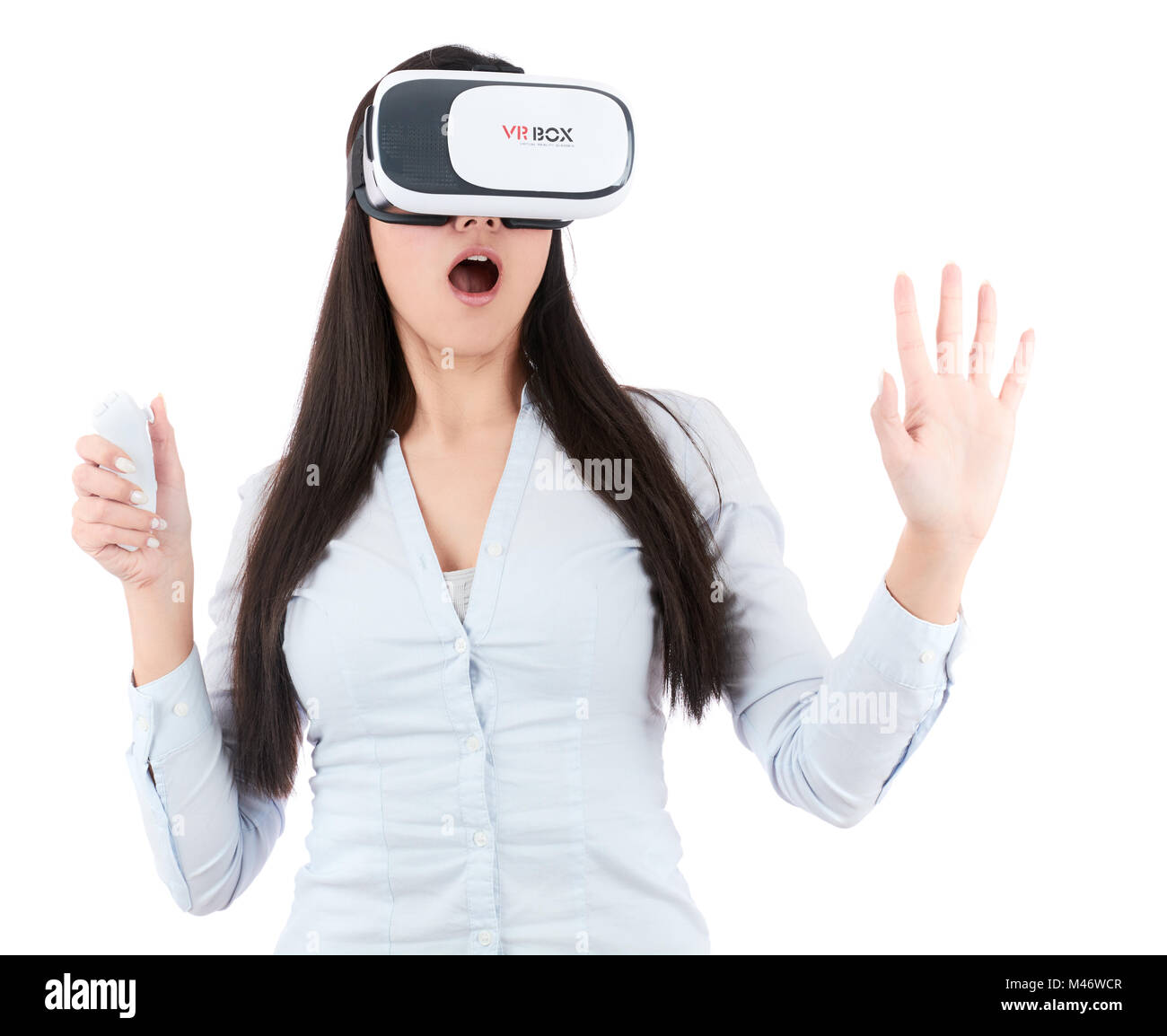 Young woman is using VR headset isolated on white background Stock ...
