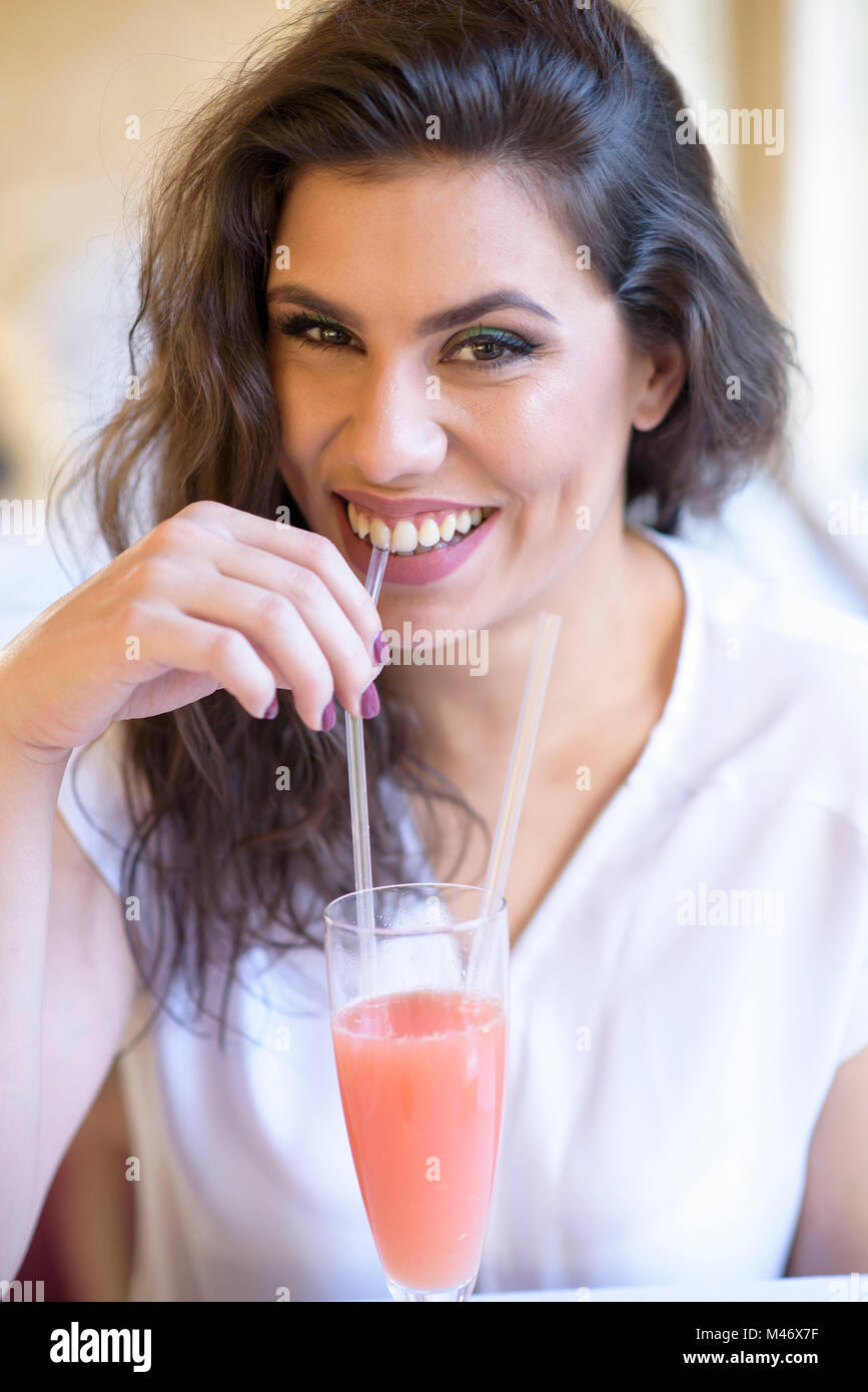 Woman drinking grapefruit drink hi-res stock photography and images - Alamy