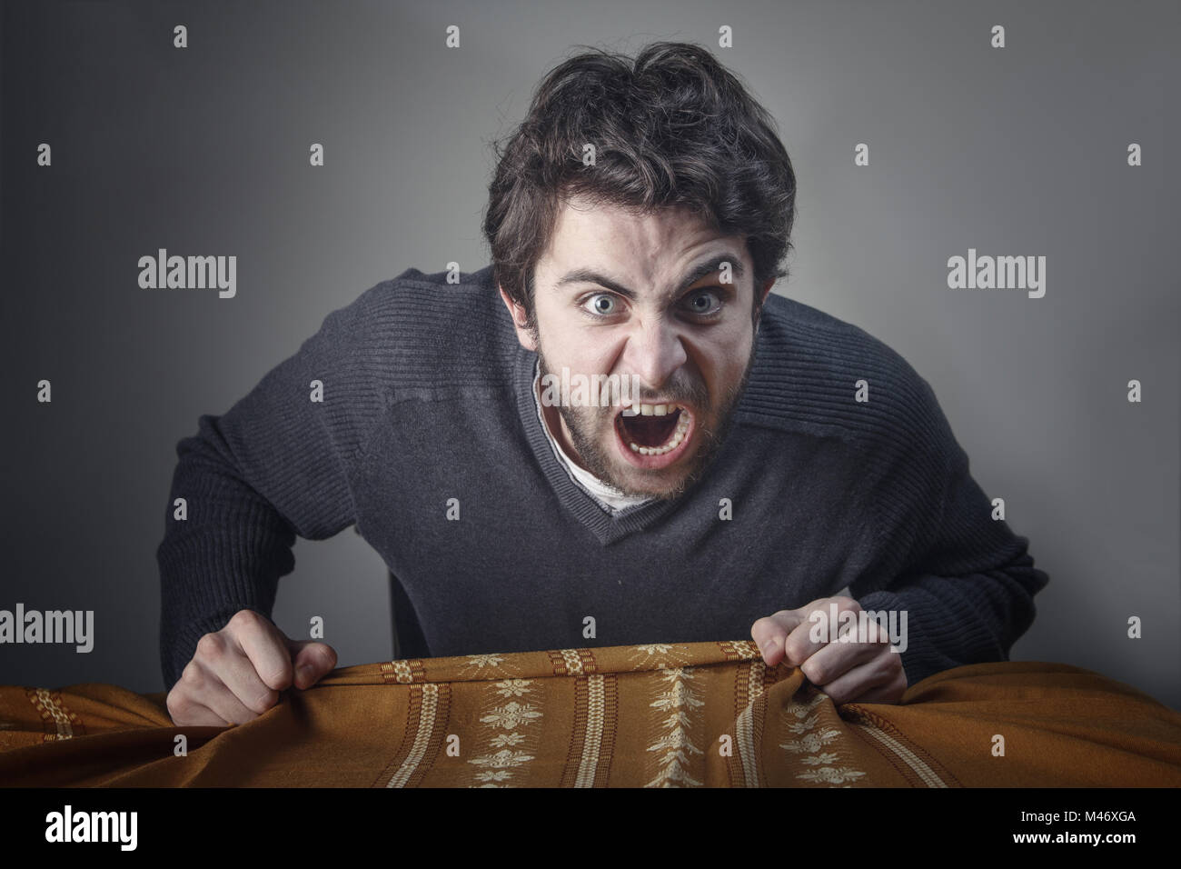 Annoyed and angry young man yelling Stock Photo - Alamy