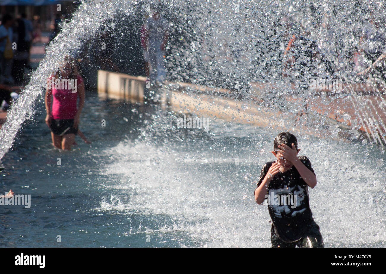 Getting wet fountain hi-res stock photography and images - Alamy
