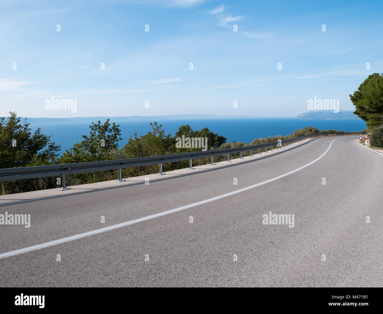 Empty road with sea view on Adriatic sea coast Stock Photo - Alamy