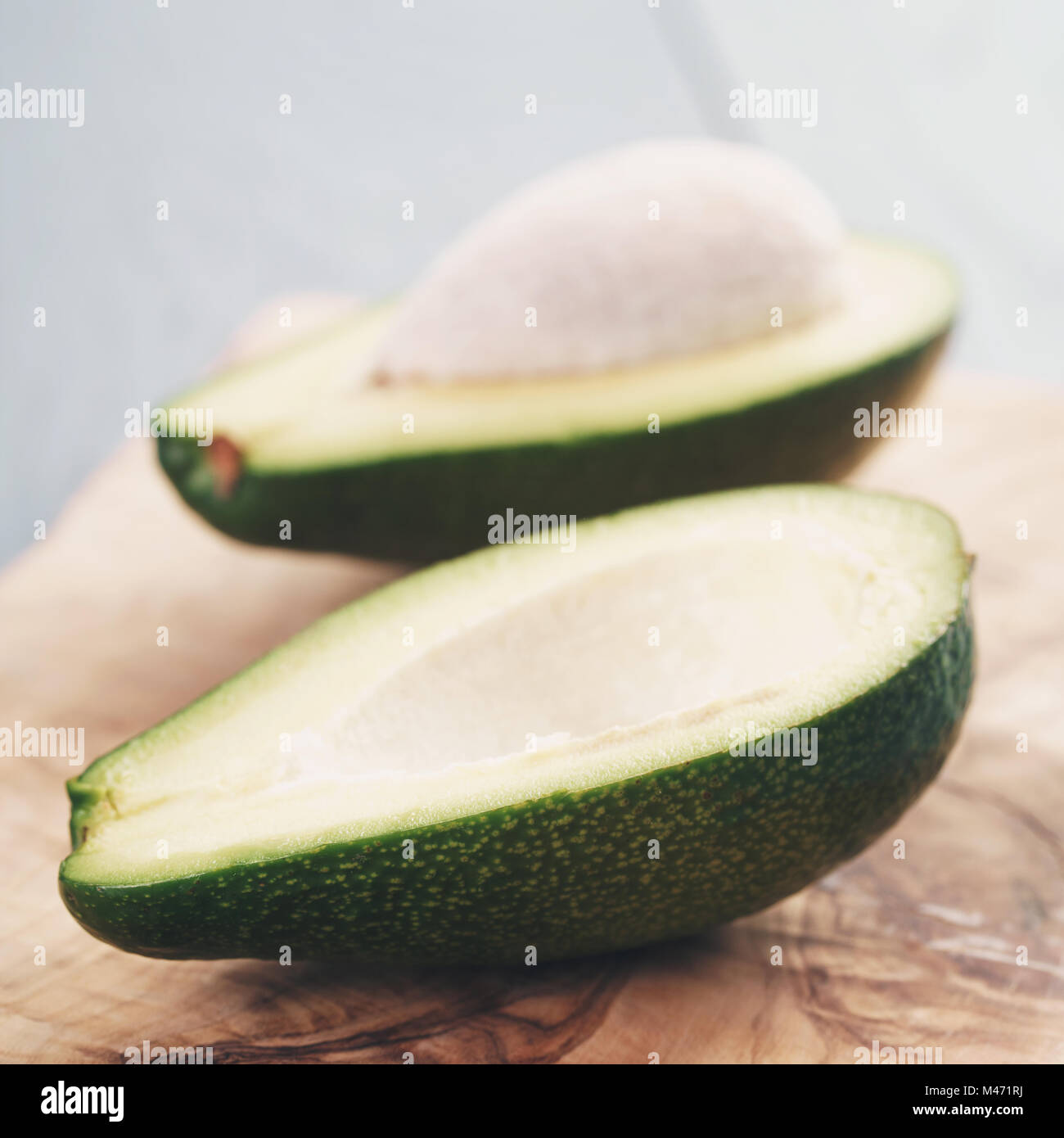 ripe green avocados on wood table Stock Photo - Alamy